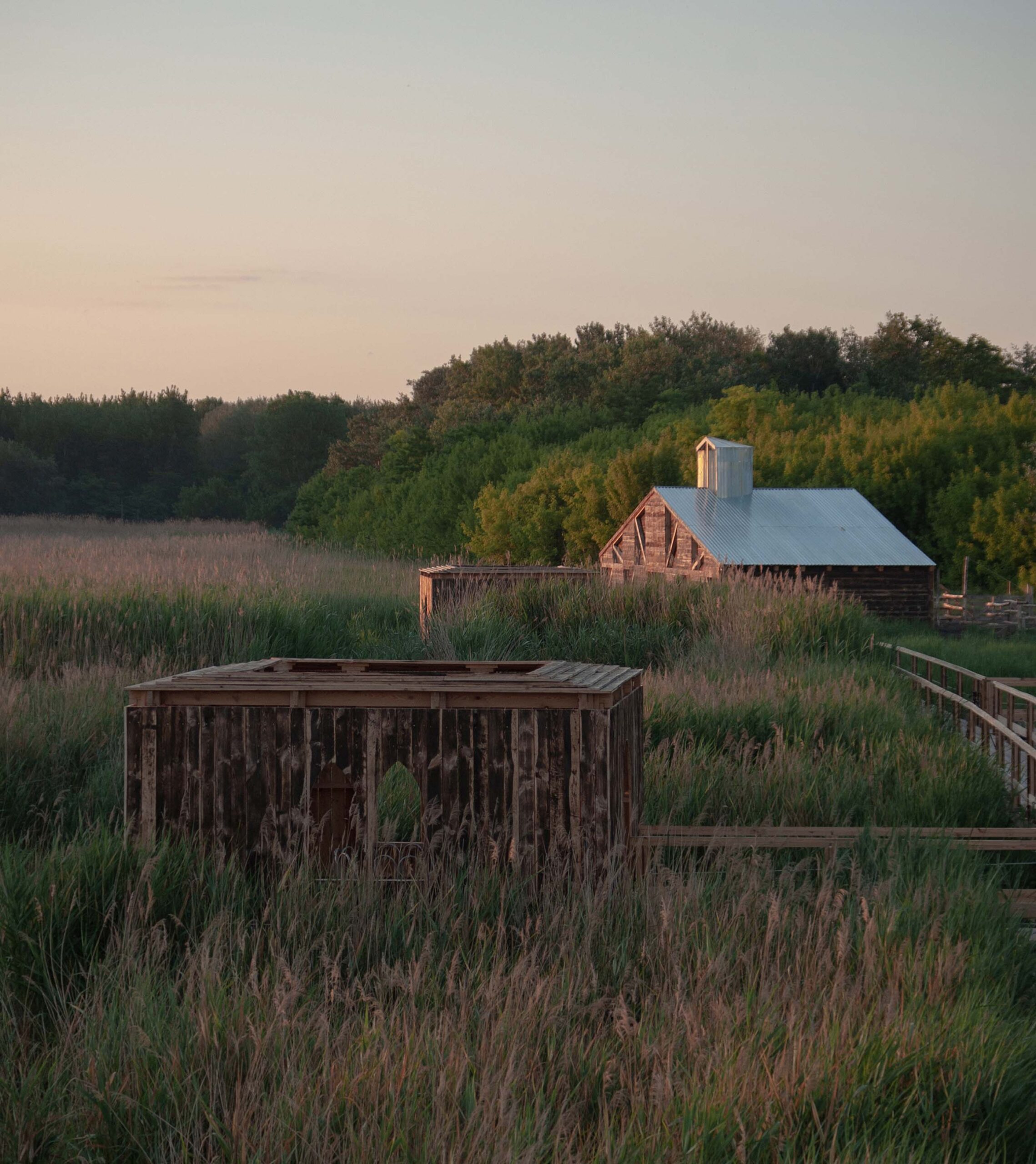 A buffalo barn and nature observation trail reflecting rural geometries ...